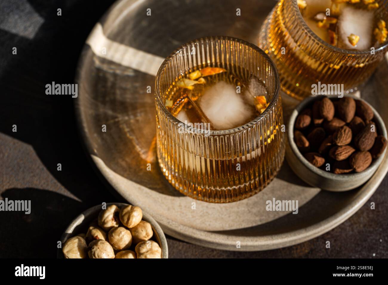 Top view of a spiced cognac-based cocktail adorned with a cinnamon and ...