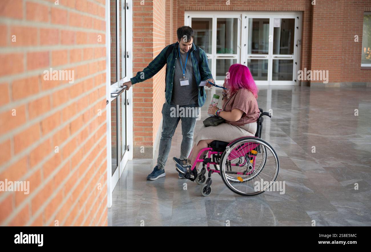 A couple in a college setting, focusing on accessibility The woman, who ...