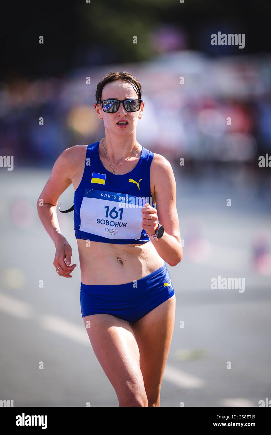 Olena Sobchuk participating in the 20 Kilometer Race Walk at the Paris 2024 Olympic Games with ...