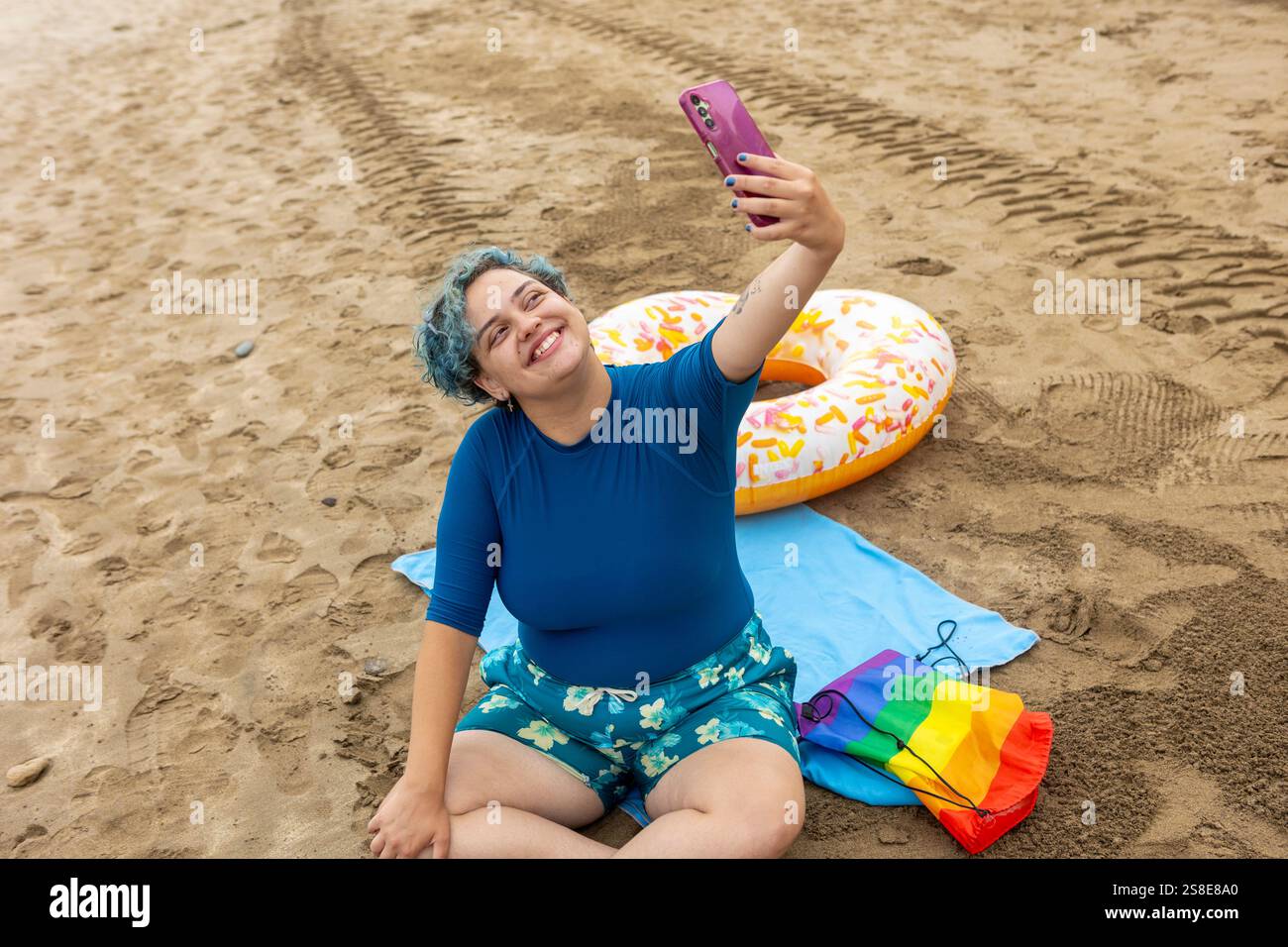 A cheerful transgender man, feeling positive and free, is capturing a ...
