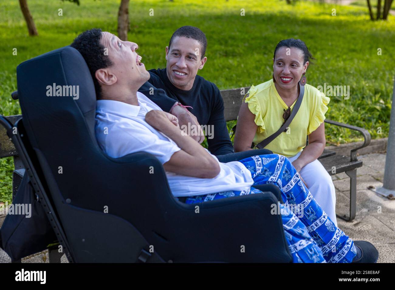 Spanish-Cameroonian siblings share a joyful moment outdoors. The mixed ...