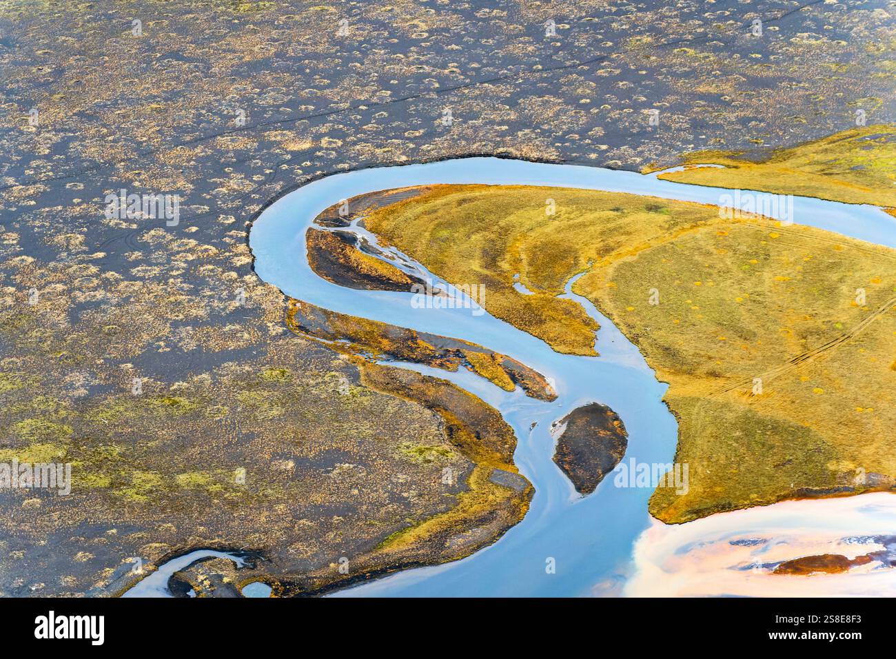 Aerial view showcasing Iceland's winding rivers cutting through vibrant ...