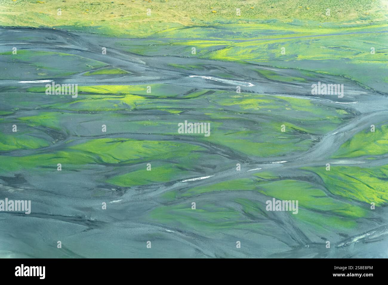 Aerial view of Iceland's braided rivers creating intricate patterns ...