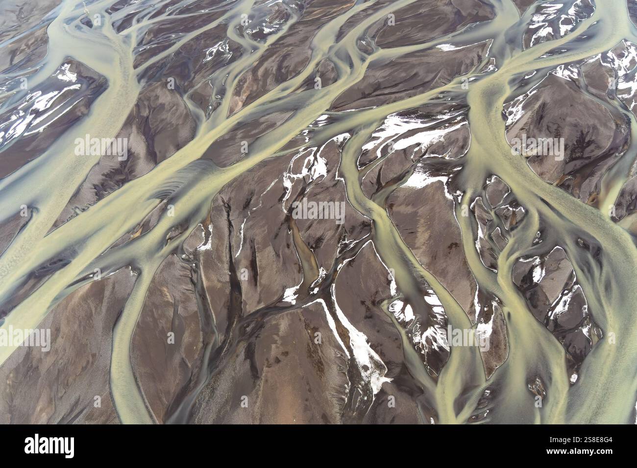 Dramatic aerial shot capturing the stunning, serpentine flows of golden ...