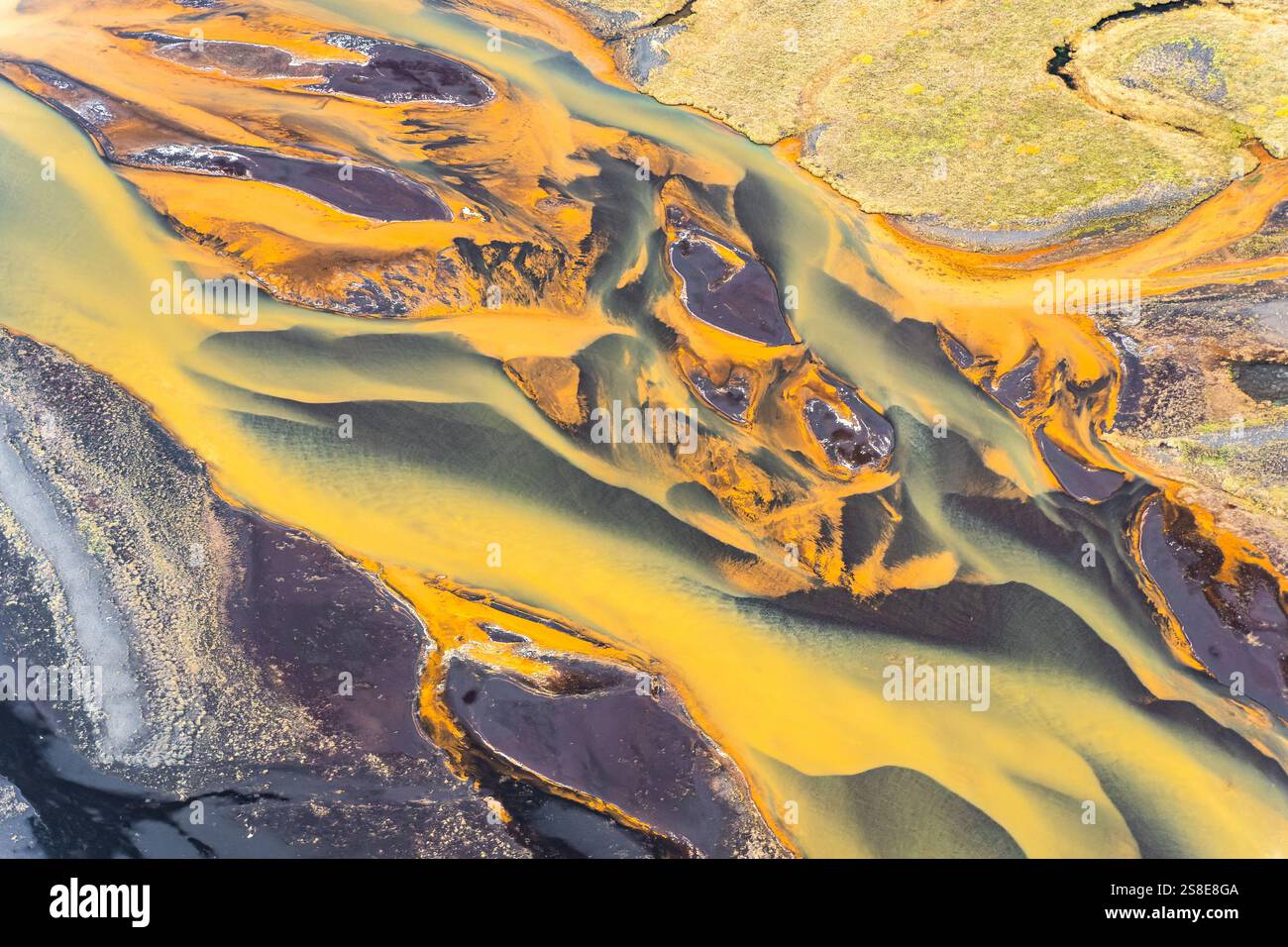 "Stunning aerial capture of Iceland's golden rivers winding through ...