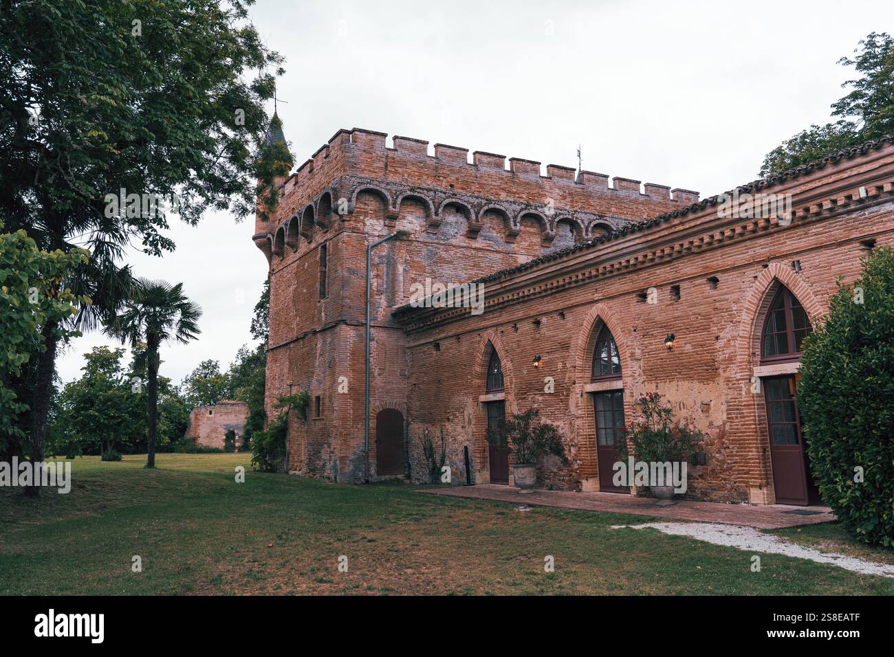 A historic Chateau Caumont castle featuring arched windows and a turret ...