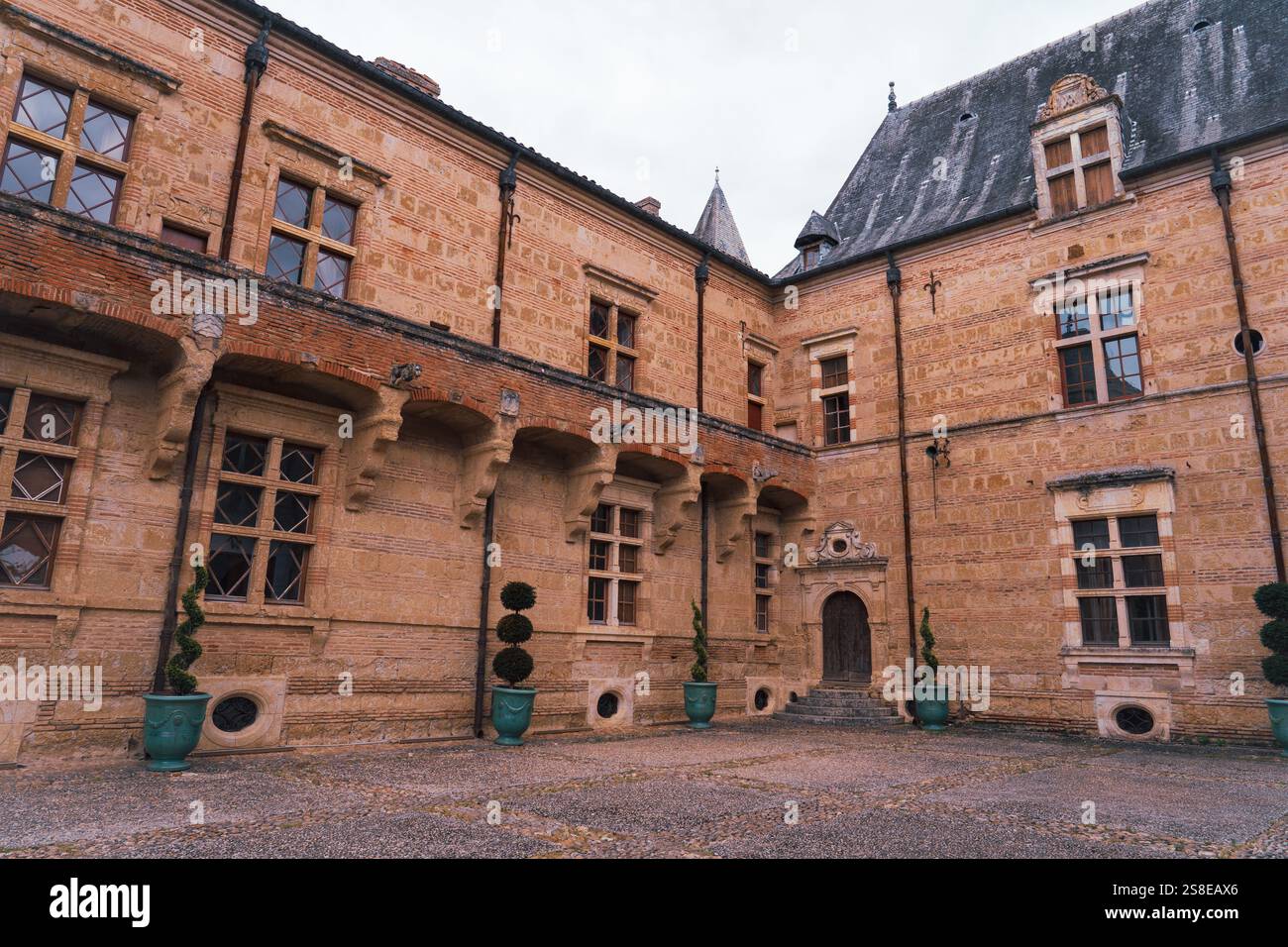 A historic Chateau Caumont castle medieval featuring arched windows and ...