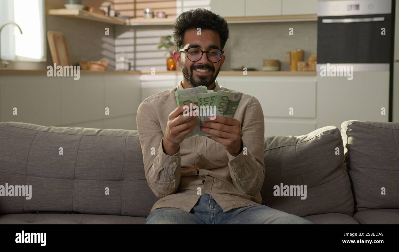 Happy rich man Arabian Indian wealthy businessman counting money cash ...