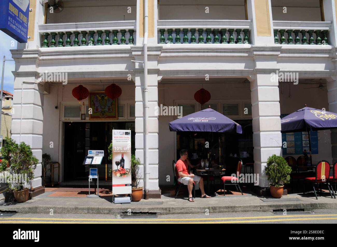 A European visitor sitting at an Indian cafe in Clive Street in the ...