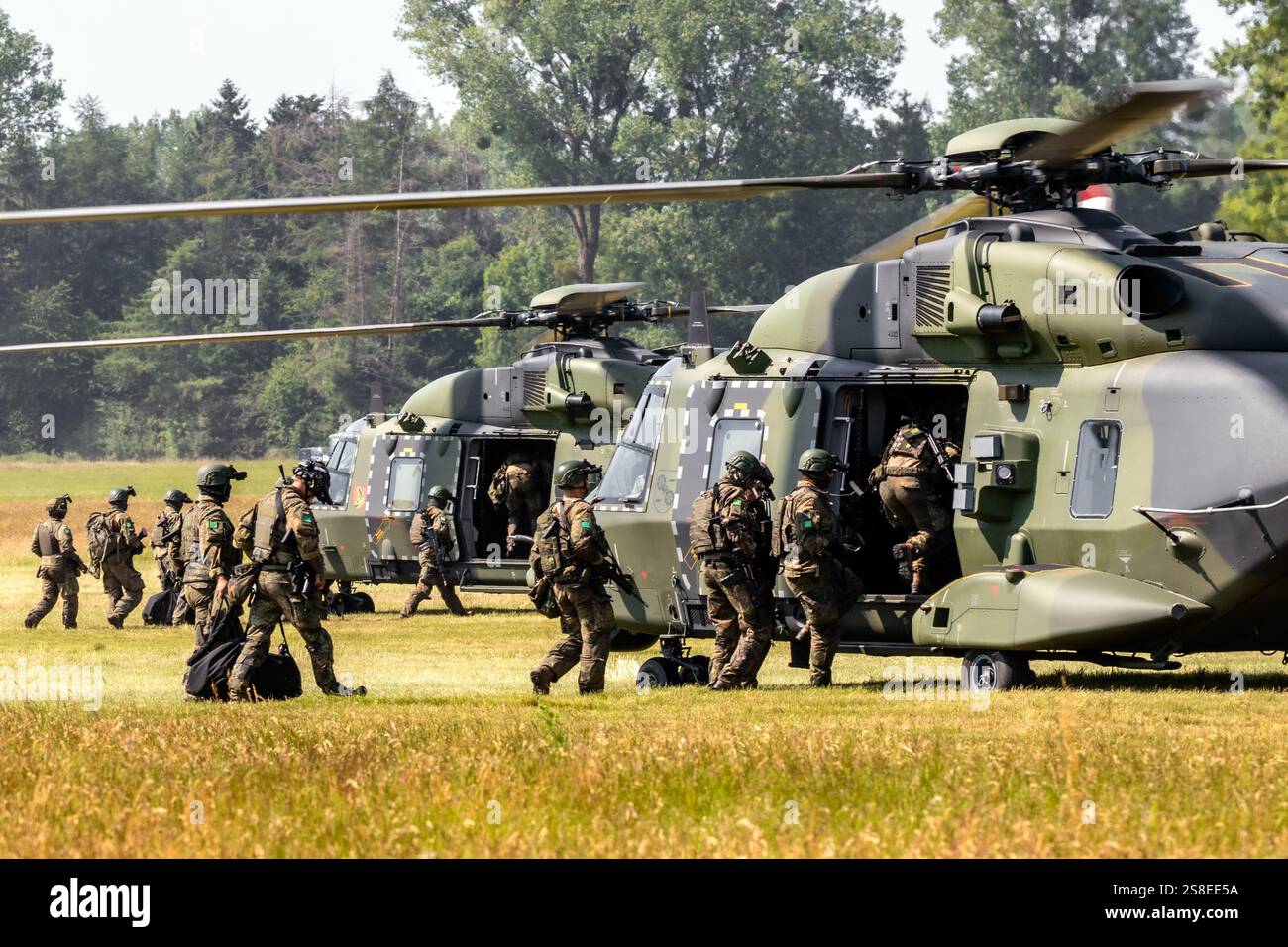 German army soldiers embarking two NHIndustries NH90 helicopters at a ...