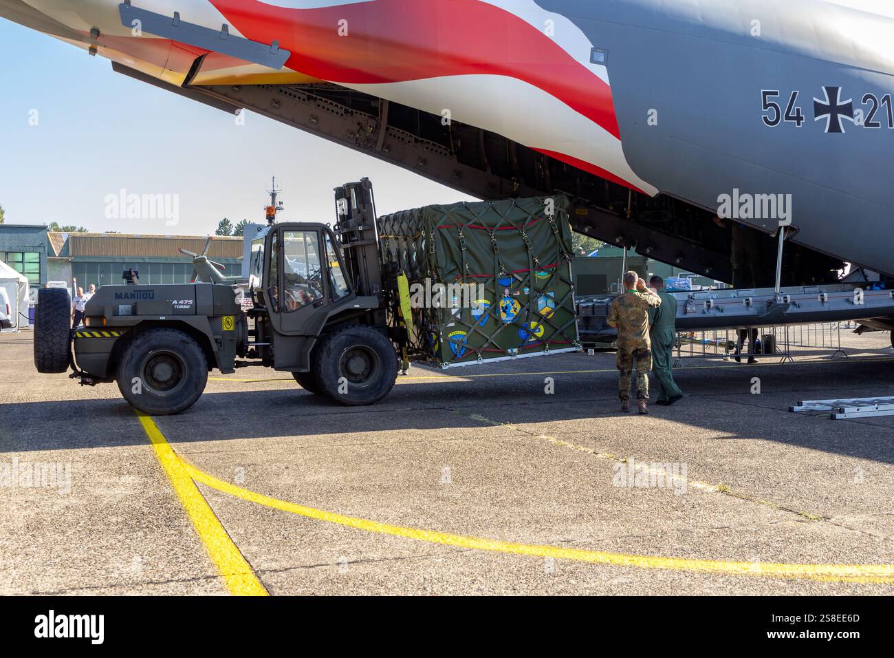 Forklift unloading cargo from a German Air Force Airbus A400M transport ...