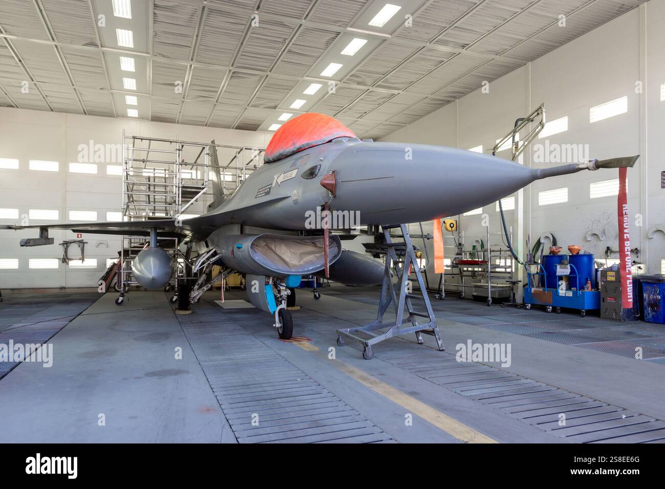 General Dynamics F-16 Fighting Falcon fighter jet in a paint shop ...