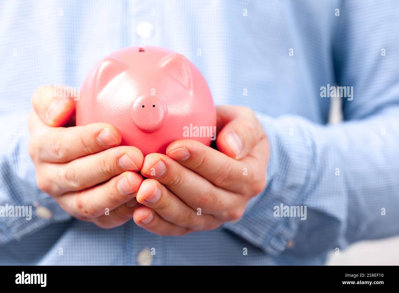 Businessman protecting his savings Stock Photo - Alamy