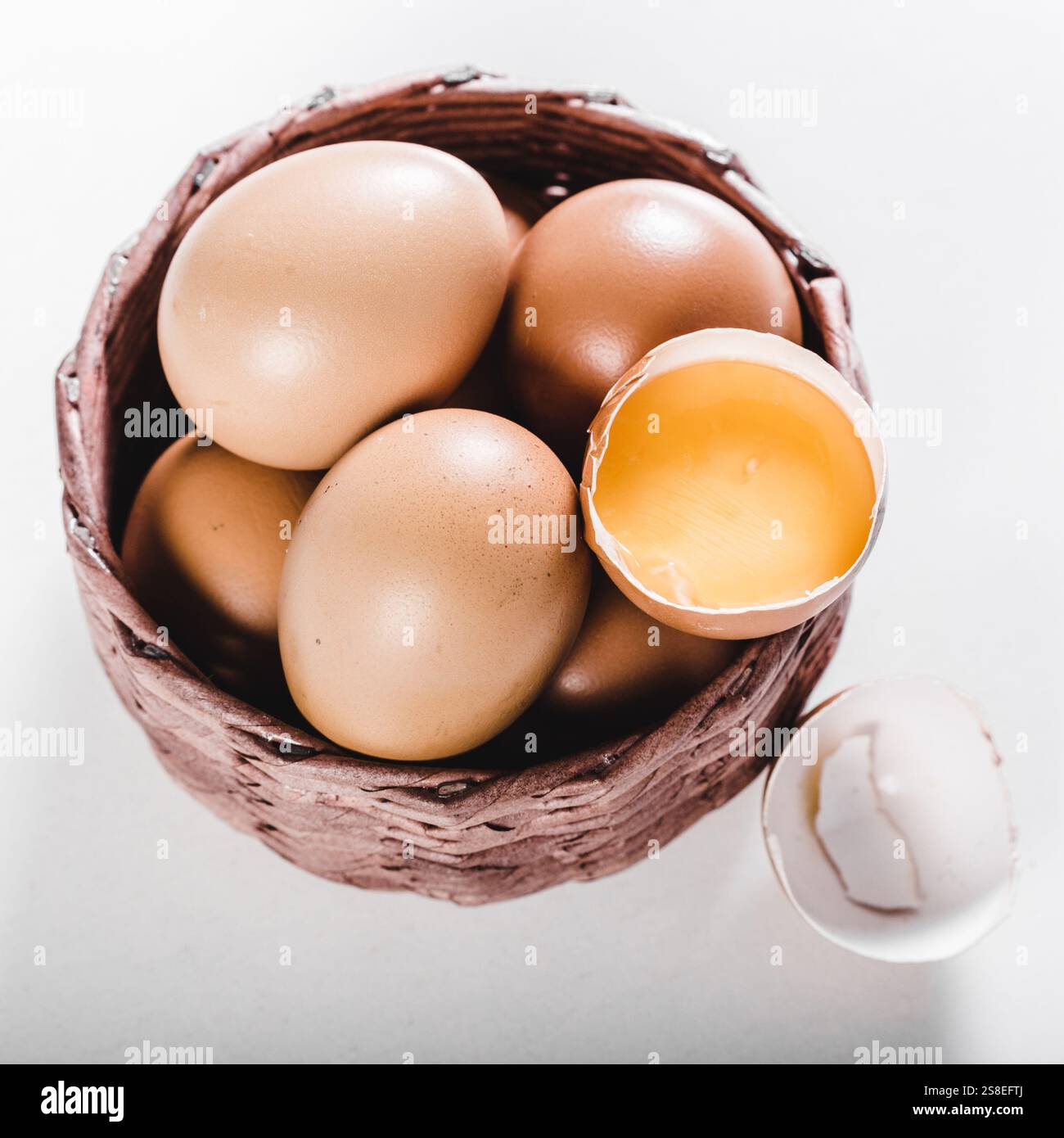 Easter egg in a basket Stock Photo - Alamy