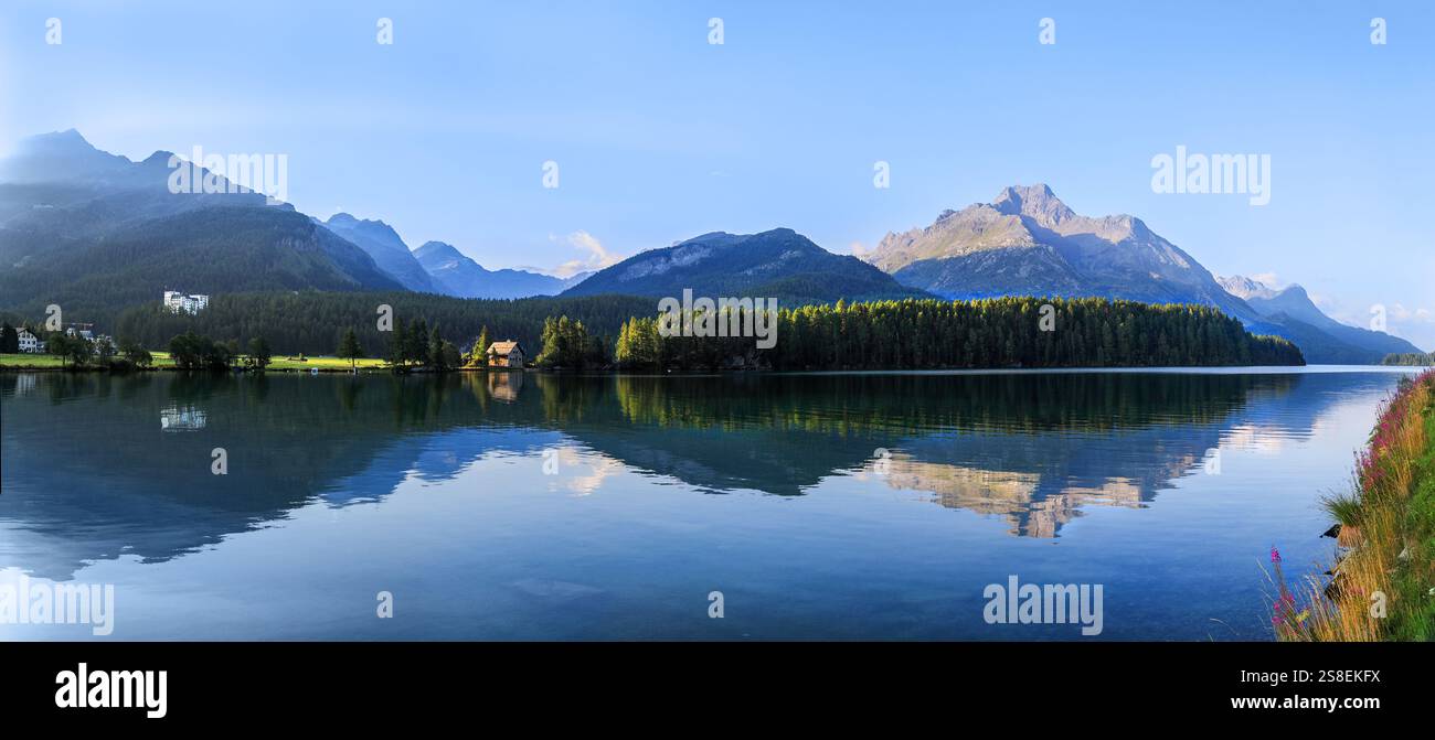 Lake Sils and the Chaste island in the morning with reflection in Sils ...