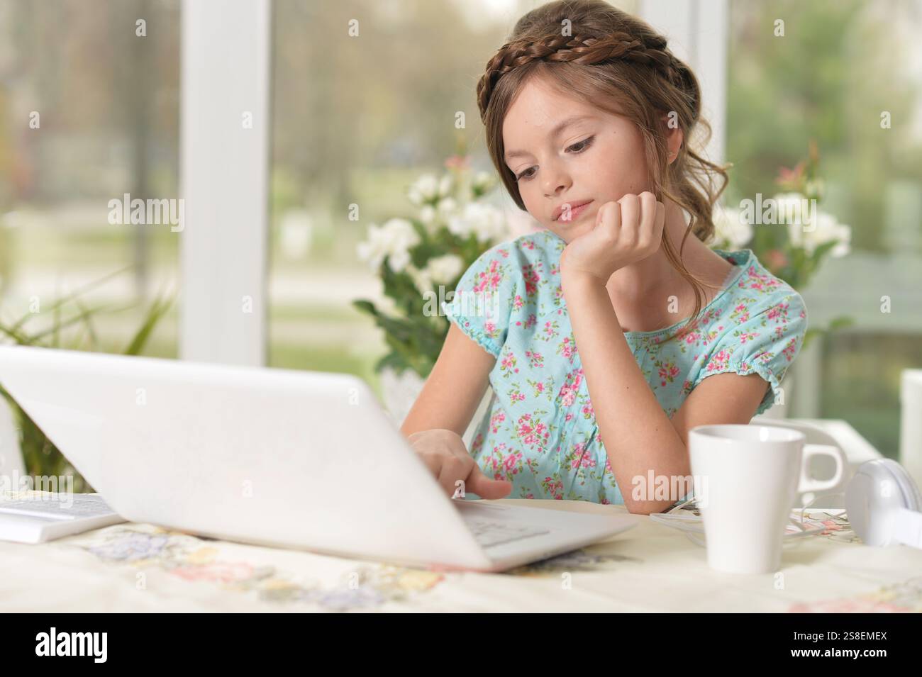 Cute and happy little girl children using laptop computer Stock Photo ...