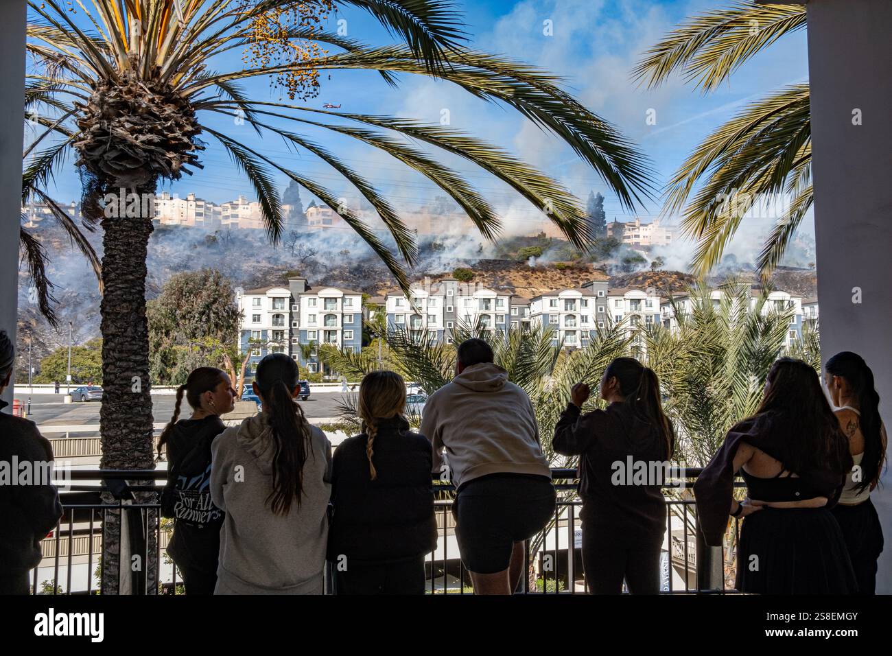 People watch the Friars Fire as it burns from Fashion Valley Mall in ...