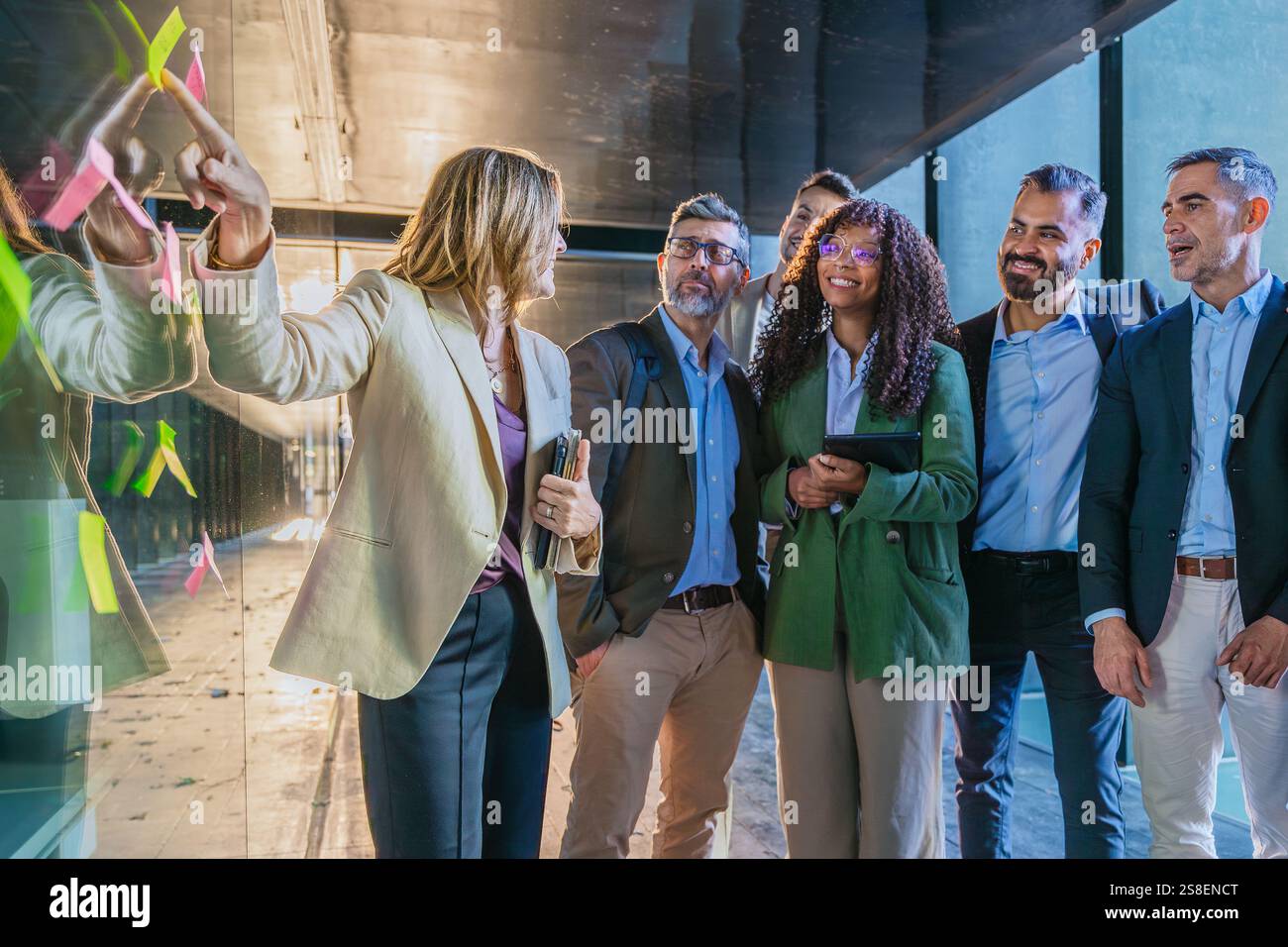 Professionals discussing strategy during meeting hi-res stock ...