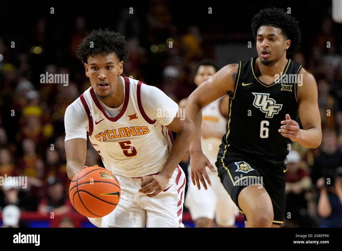 Iowa State guard Curtis Jones (5) drives up court ahead of UCF guard ...