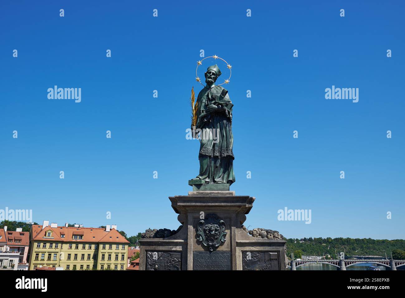 Statue of John of Nepomuk mounted to the balustrade of Charles Bridge ...