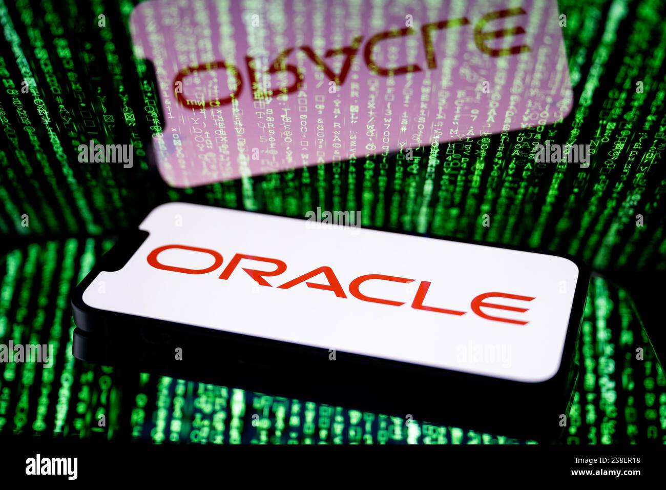 In this photo illustration, the Oracle logo seen displayed on a ...