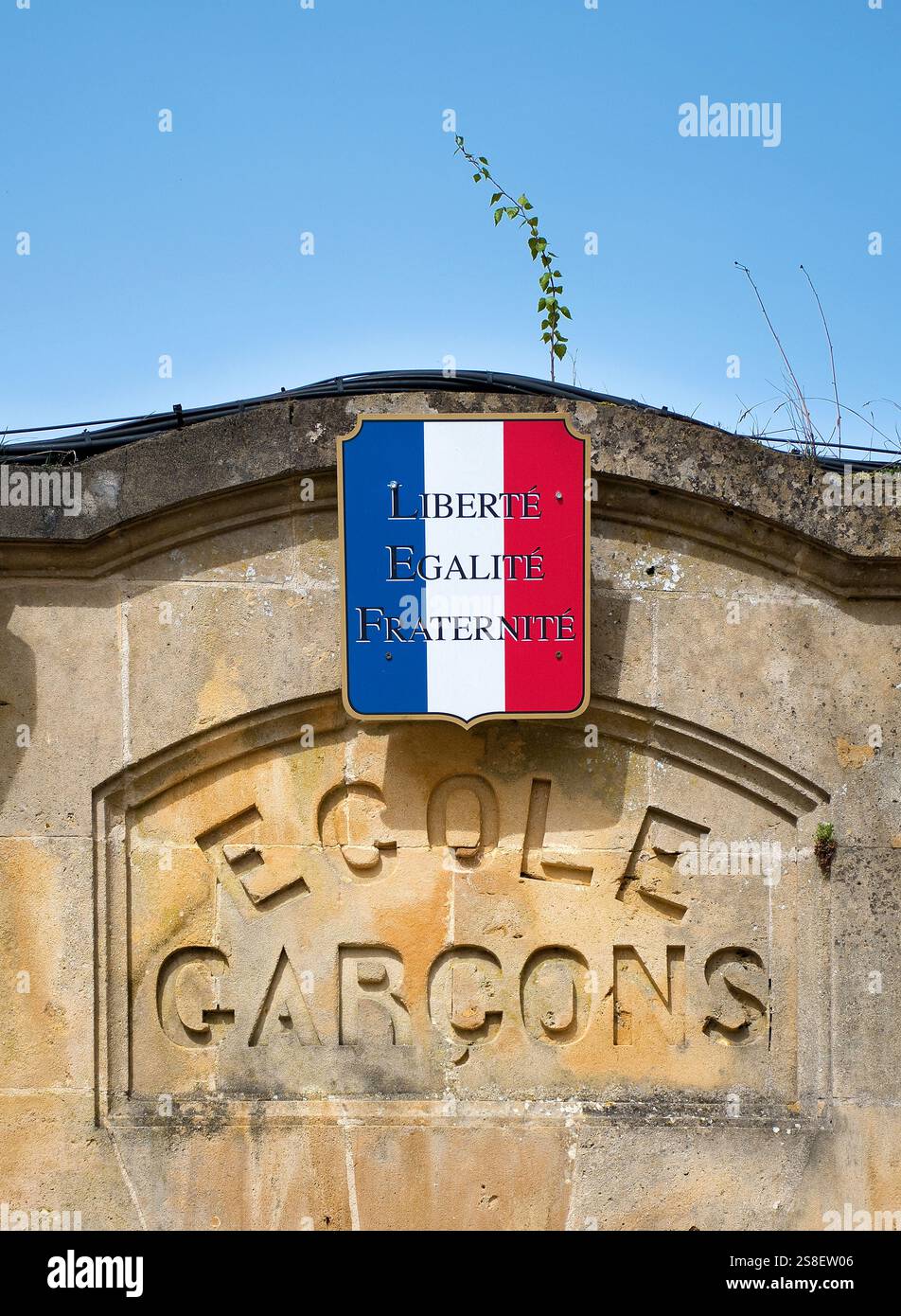 Marville, France, Archway of the school for boys with French flag with ...