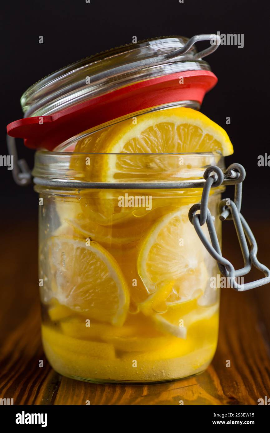 sliced lemons in sugar syrup in a glass jar, canned Stock Photo - Alamy