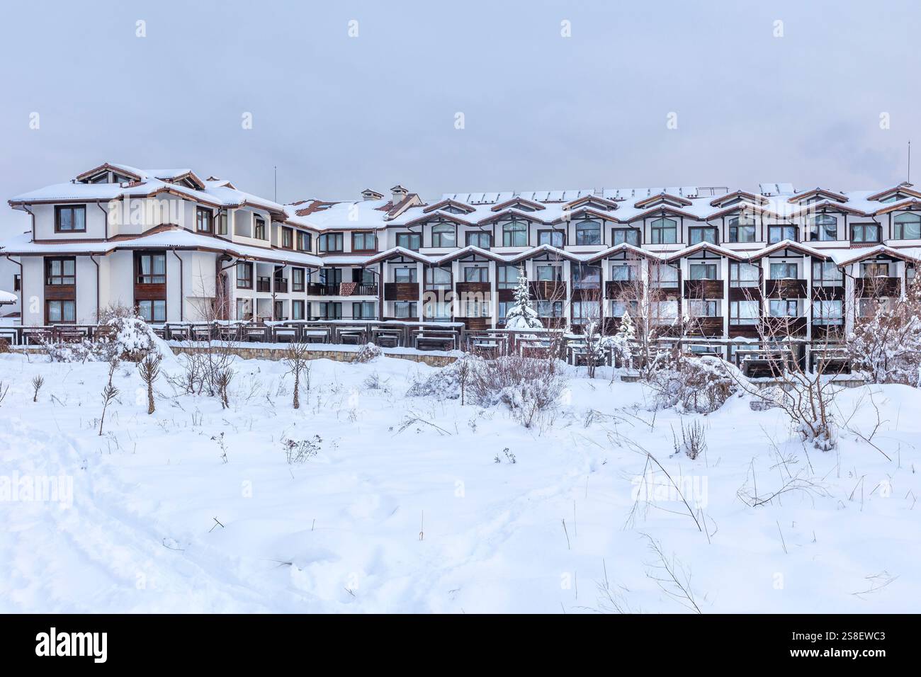 Bansko, Bulgaria winter street view, houses and Pirin snow mountain ...