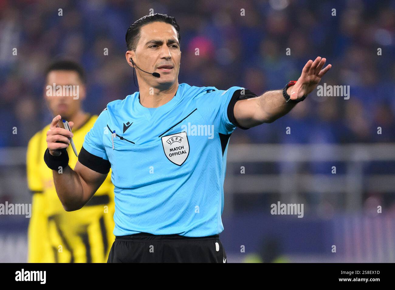Referee Serdar Gozubuyuk gestures during the Champions League football ...