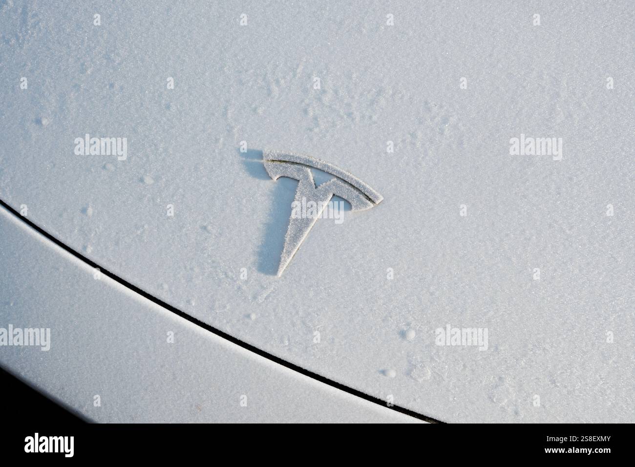 Glasgow Scotland: 8th Jan 2025: Frost-covered Tesla logo on a white car ...