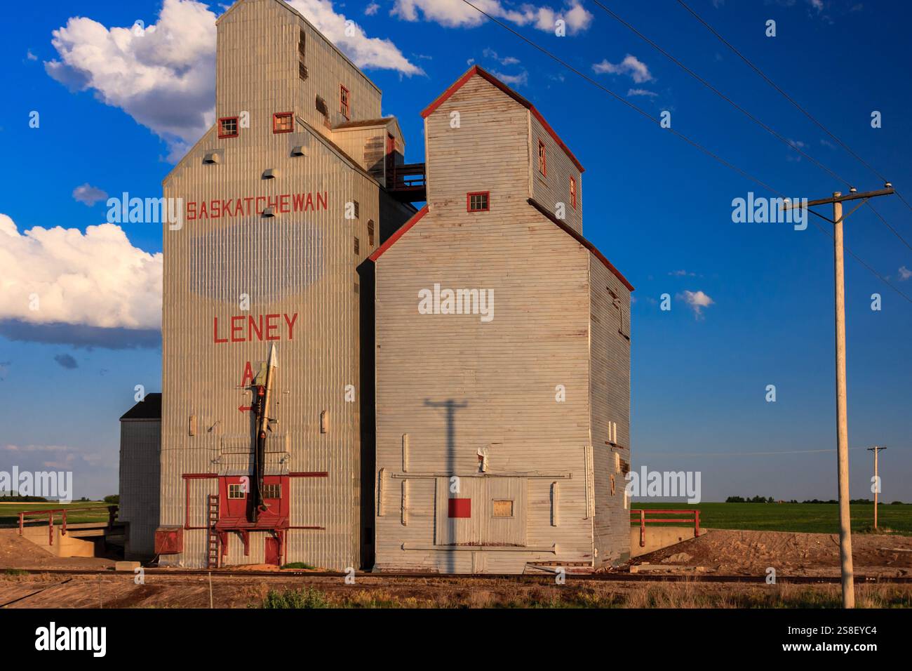 A grain silo with the name Lenny on it. The silo is old and has a ...