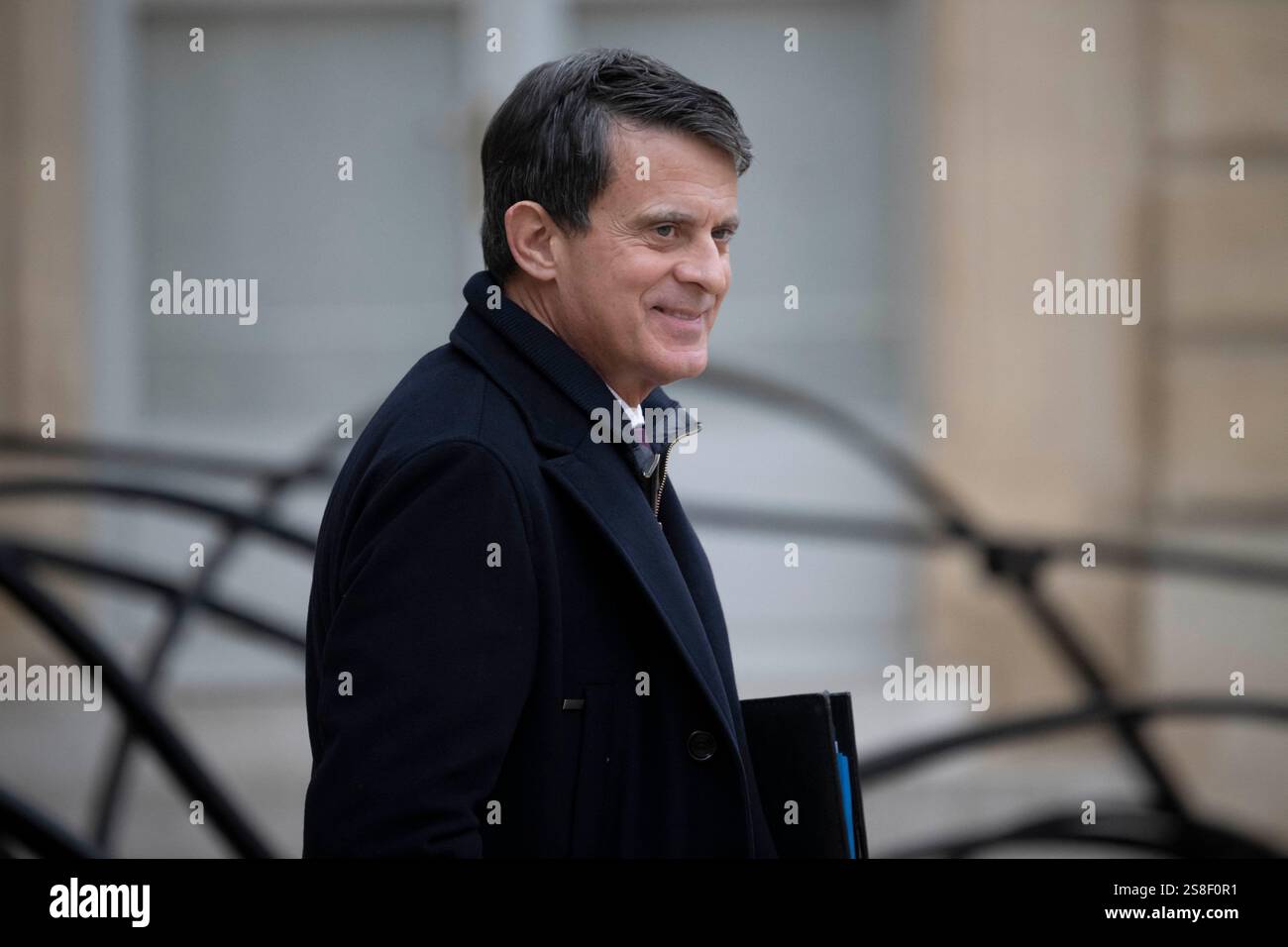 France's Minister of Overseas Manuel Valls leaves after the weekly ...