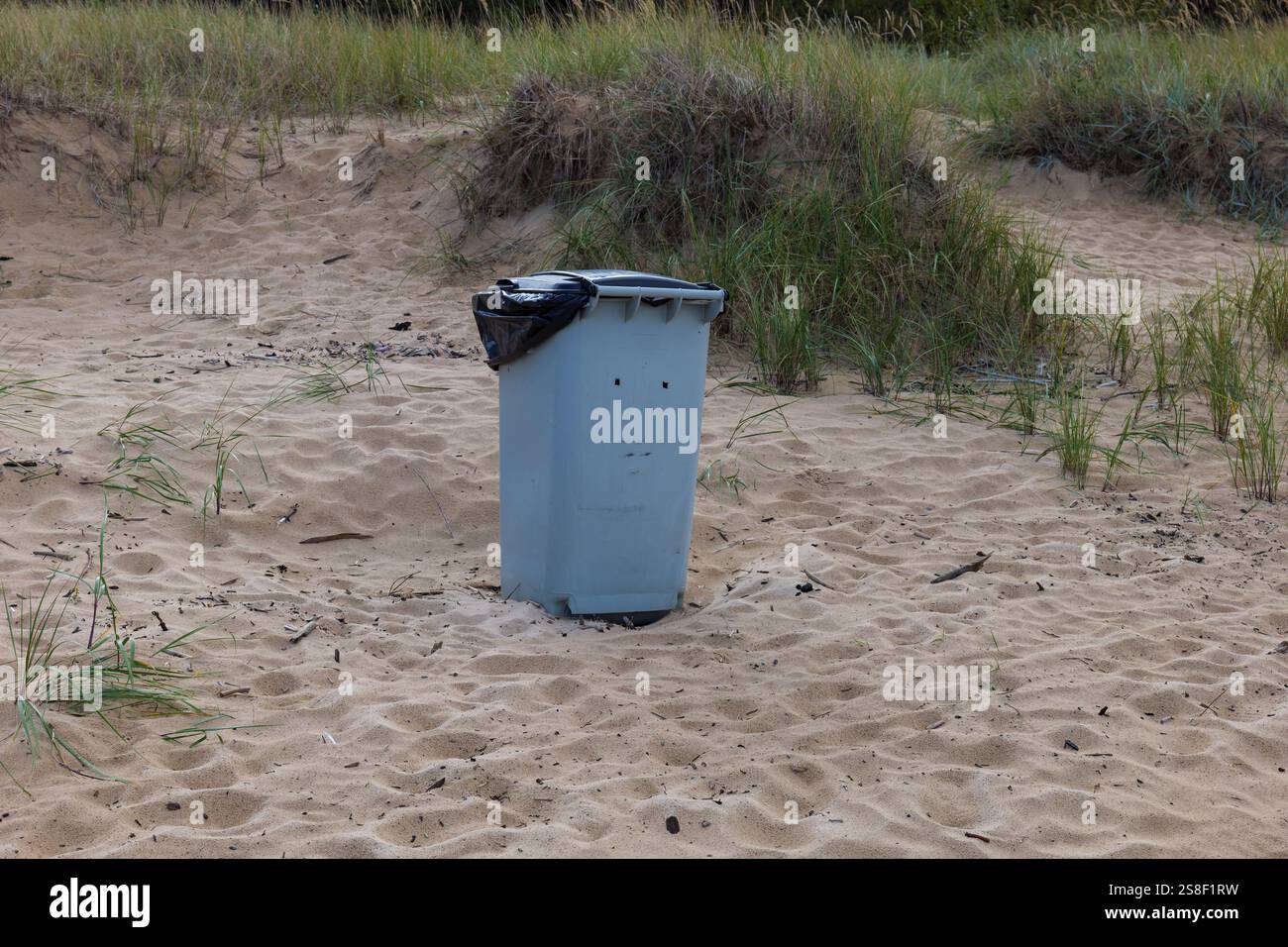 Plastic trash can on the east europe beach Stock Photo - Alamy