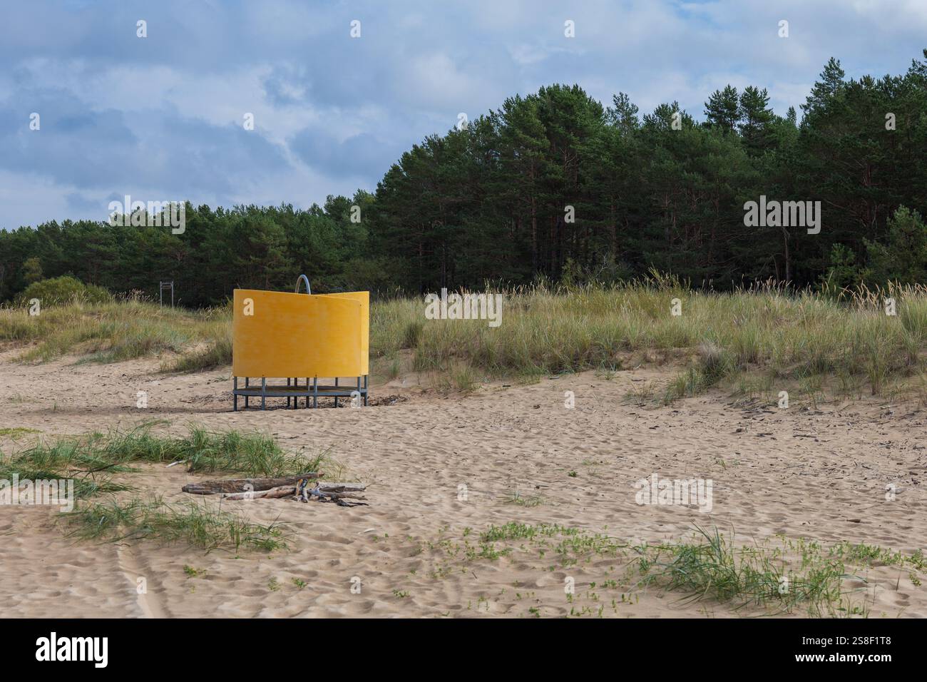 Yellow changing room on the beach Stock Photo - Alamy
