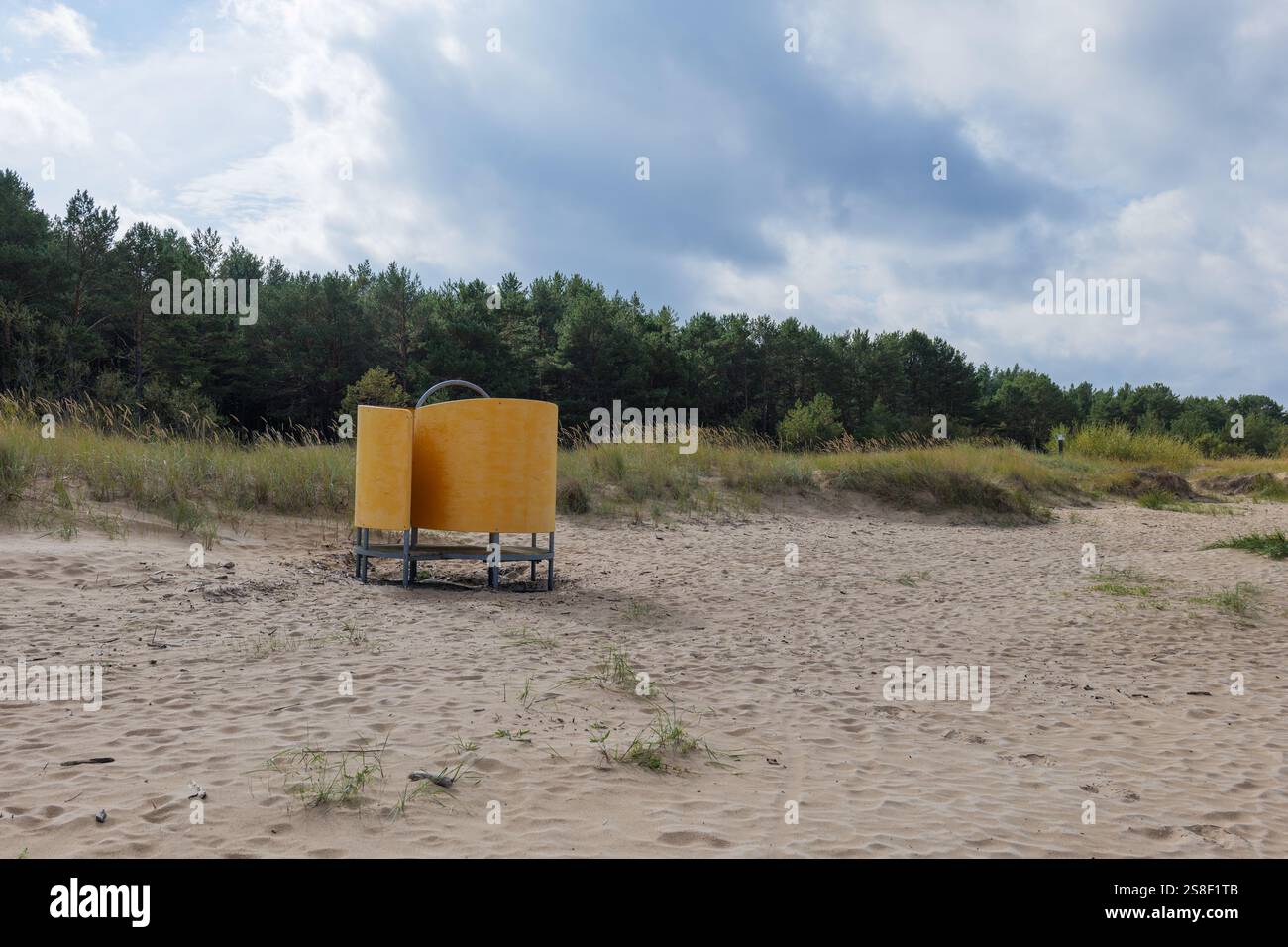 Yellow changing room on the beach Stock Photo - Alamy