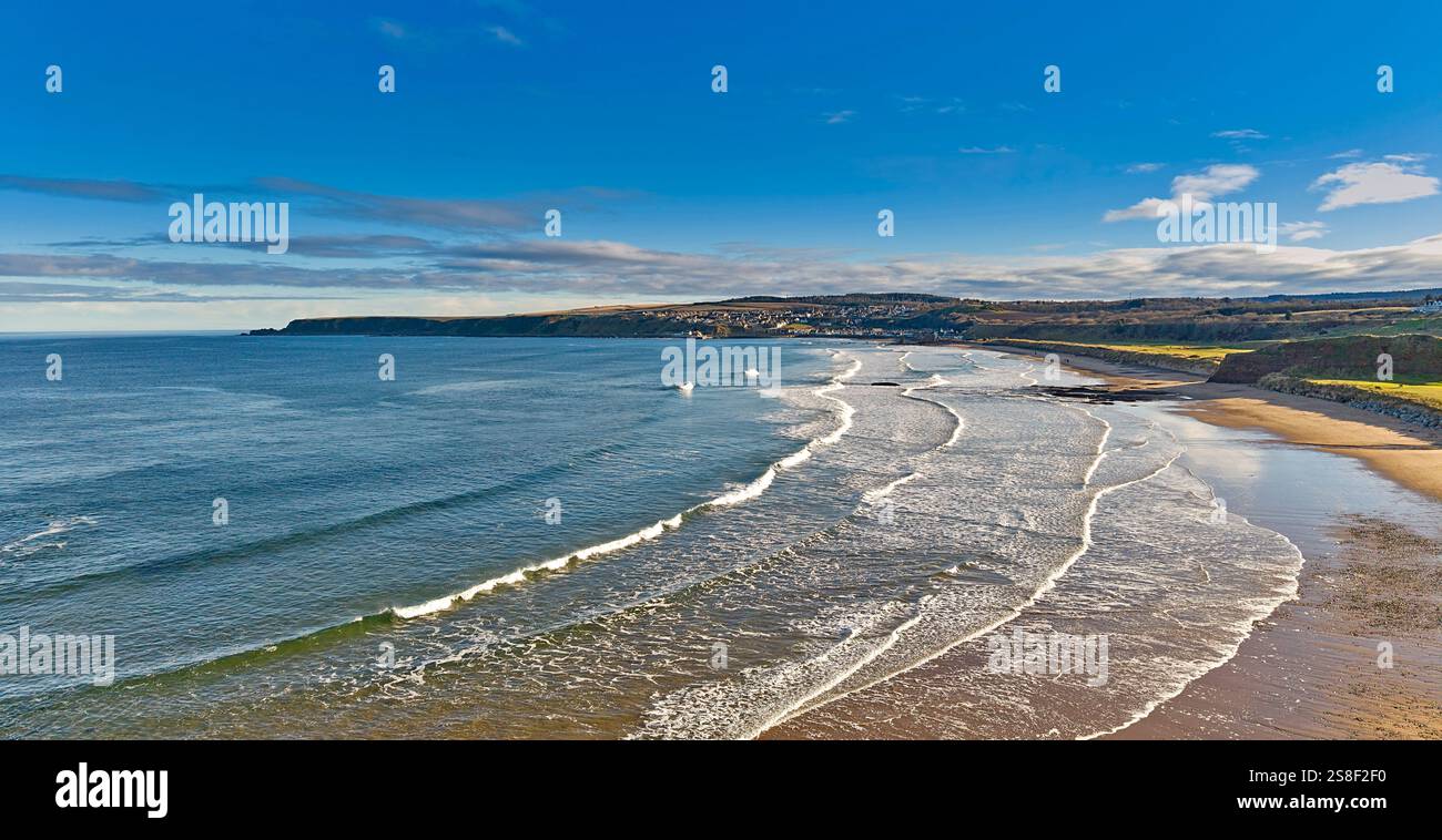 Cullen Moray Scotland a blue sky over the sea surf and sandy beach ...
