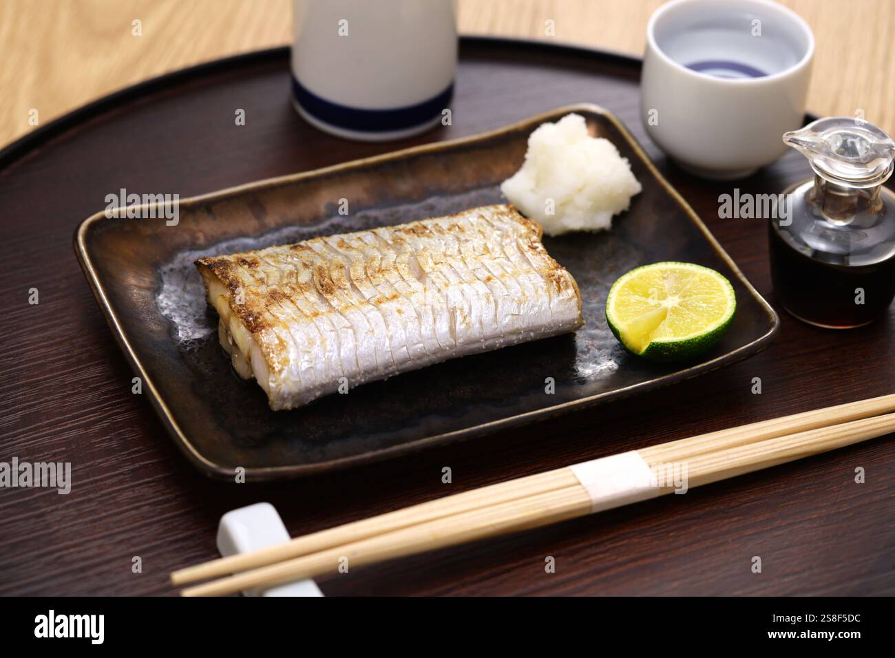 Salt-grilled hairtail fish, Japanese cuisine Stock Photo - Alamy