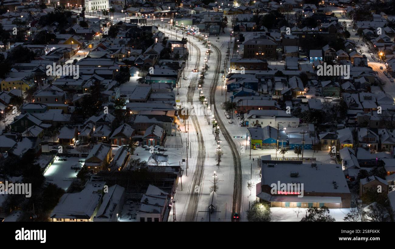 Aerial drone view of St. Claude Avenue in New Orleans blanketed in snow ...