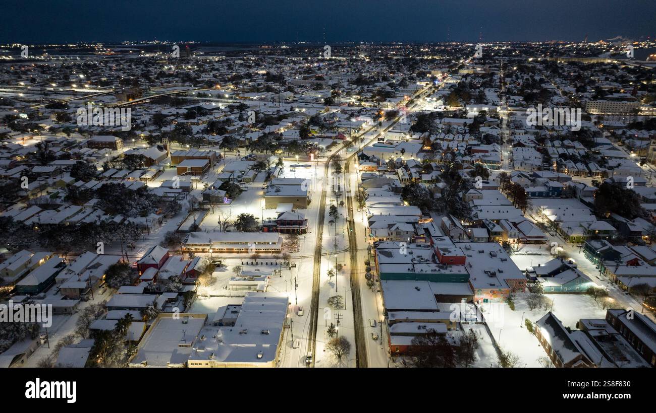 Aerial drone view of St. Claude Avenue in New Orleans blanketed in snow ...