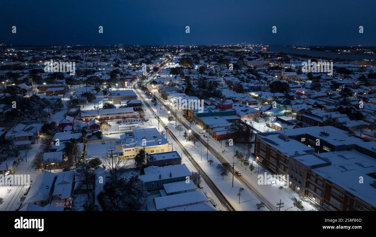 Aerial drone view of St. Claude Avenue in New Orleans blanketed in snow ...