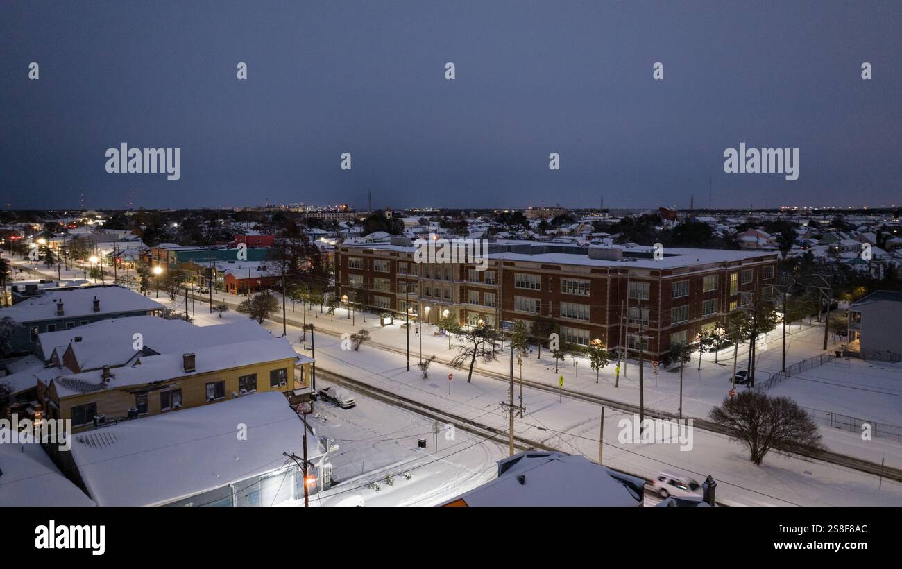 Aerial drone view of St. Claude Avenue in New Orleans blanketed in snow ...