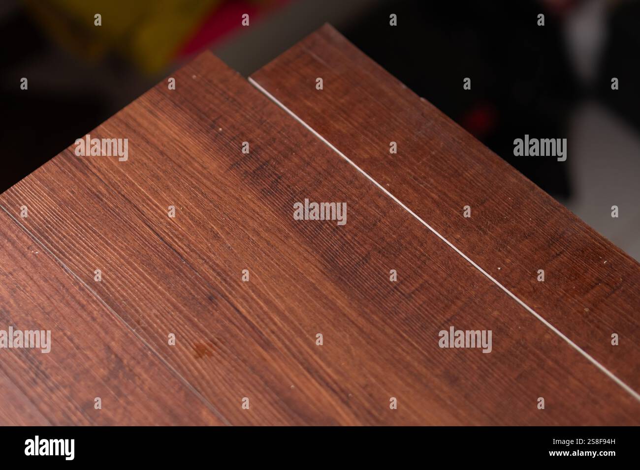 Close-up view of wooden planks with a rich brown finish, showcasing ...