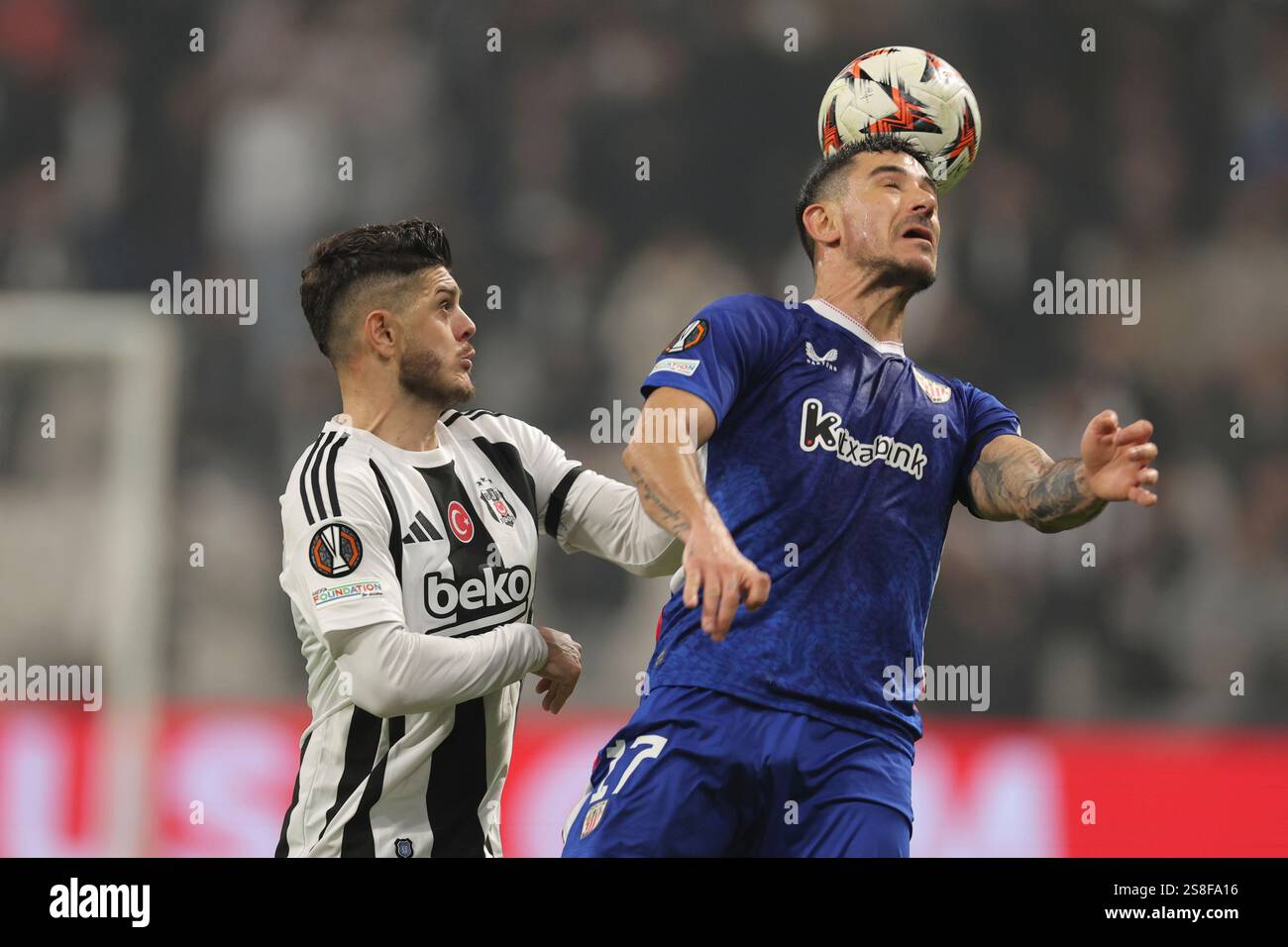 Athletic Bilbao's Yuri Berchiche, right, heads the ball against ...
