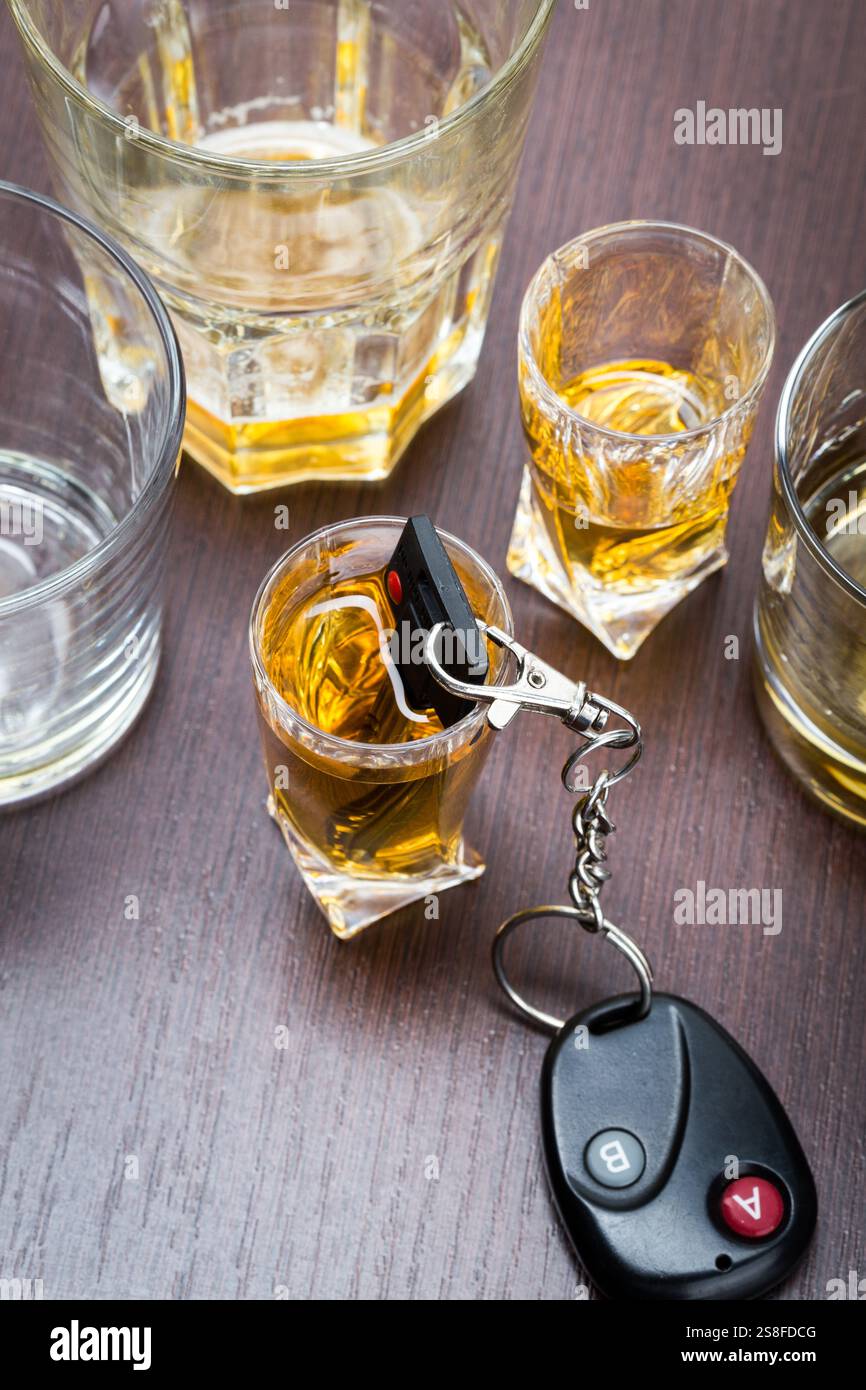 Car key on the bar with spilled alcohol Stock Photo - Alamy