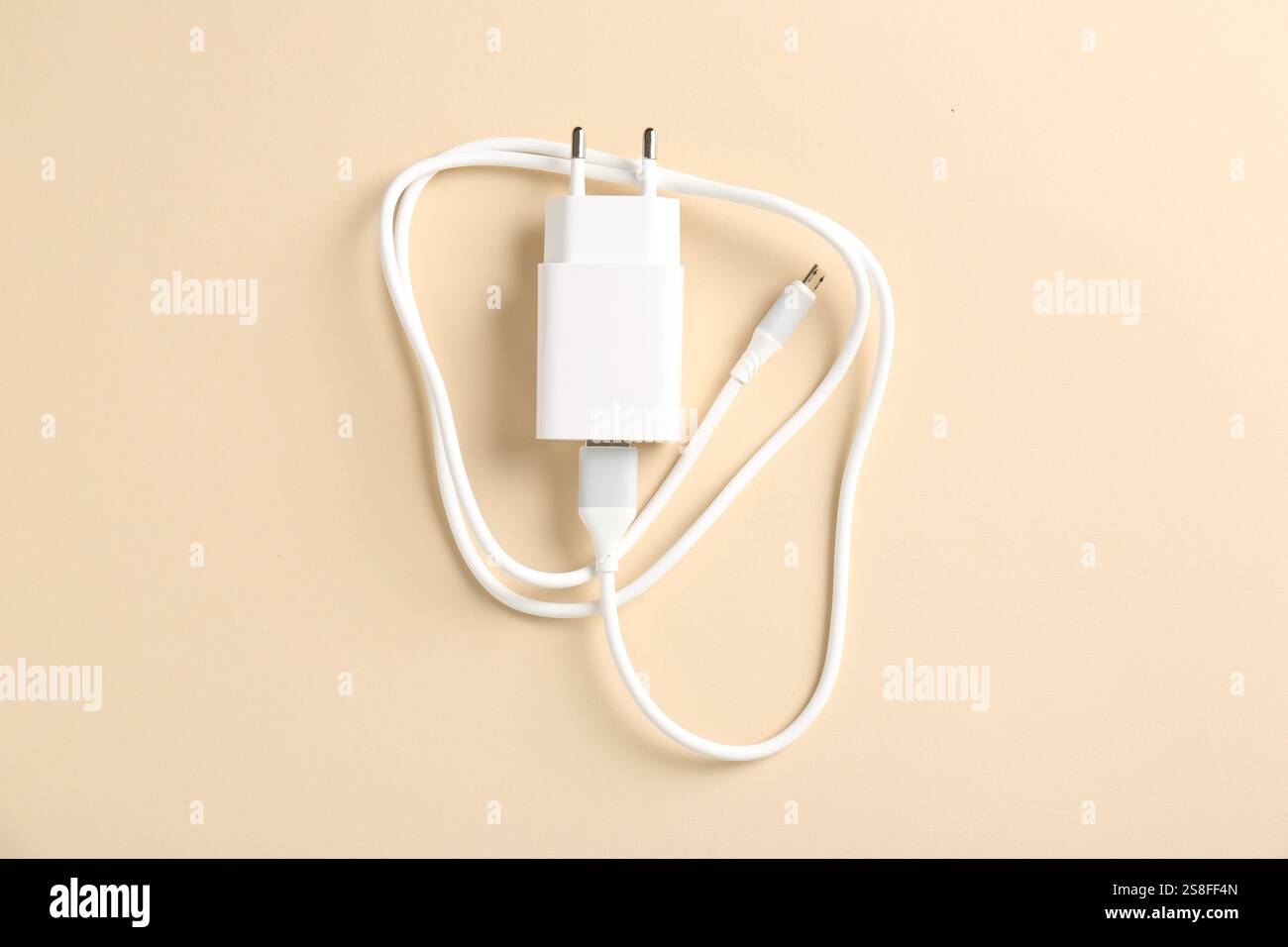 USB power adapter with charge cable on beige background, top view Stock ...