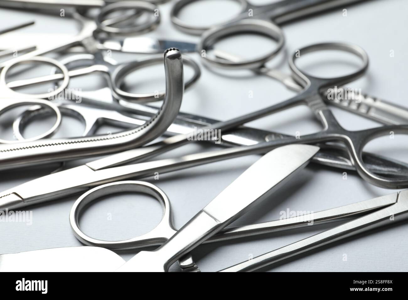 Different surgical instruments on light grey background, closeup Stock ...