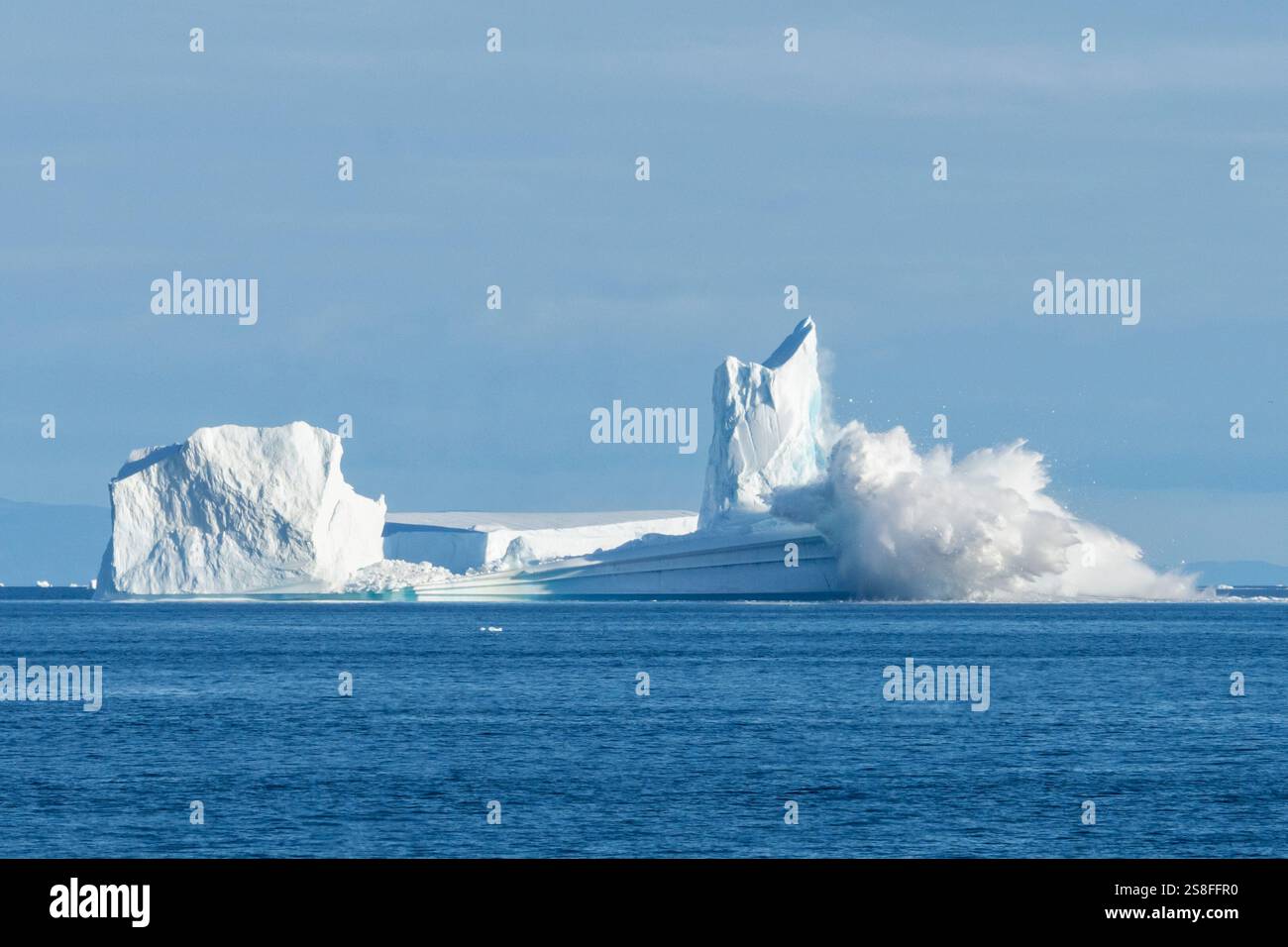 The arch of an iceberg collapses resp. is calving. This photo is one of ...