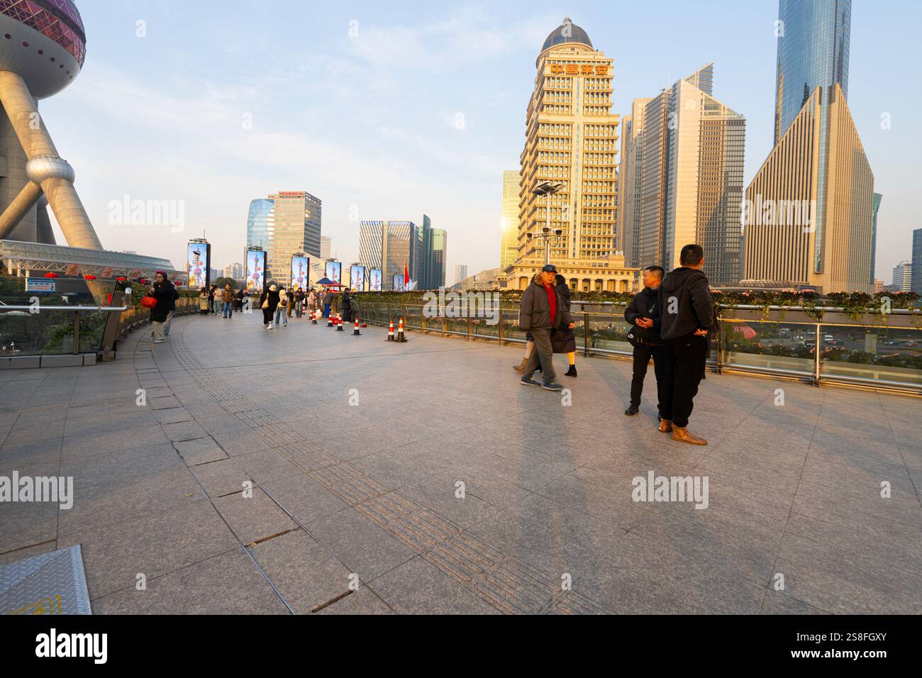 Shanghai, China. January 8, 2025. view of people walking on the Mingzhu ...