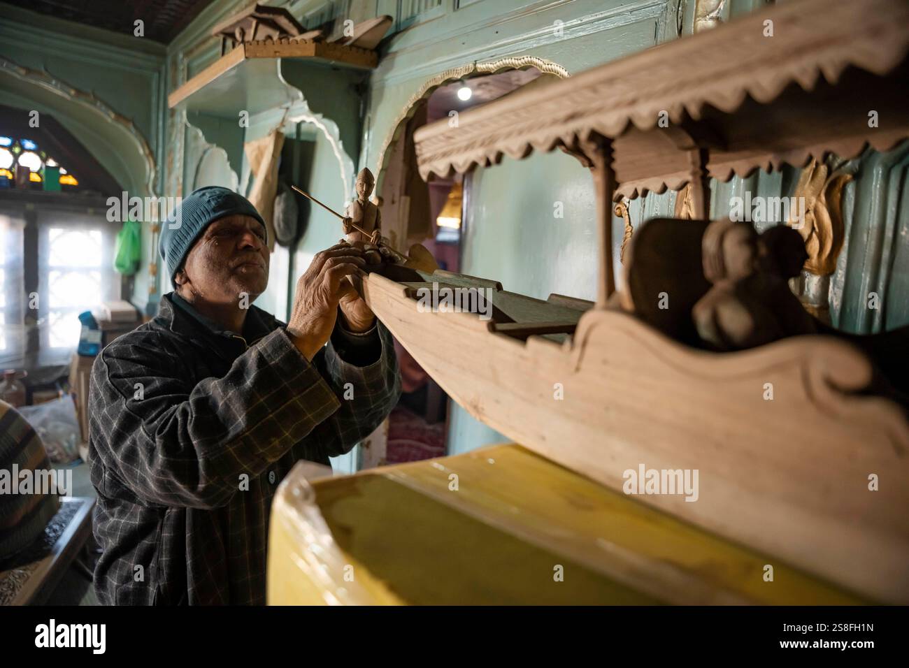 Mohammed Yousaf Muran showcases his handcrafted walnut wood replica of ...