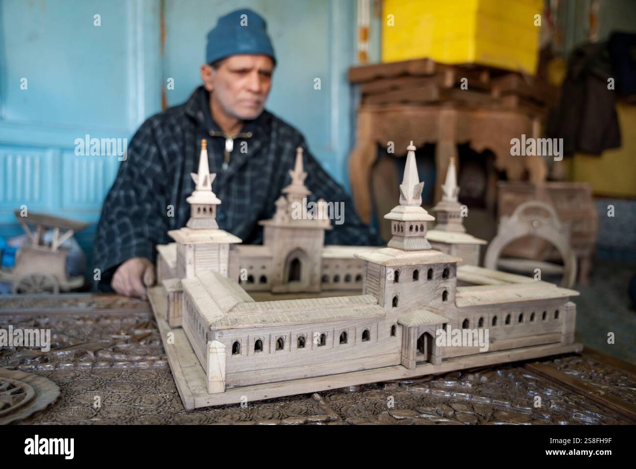Mohammed Yousaf Muran showcases his handcrafted walnut wood replica of ...